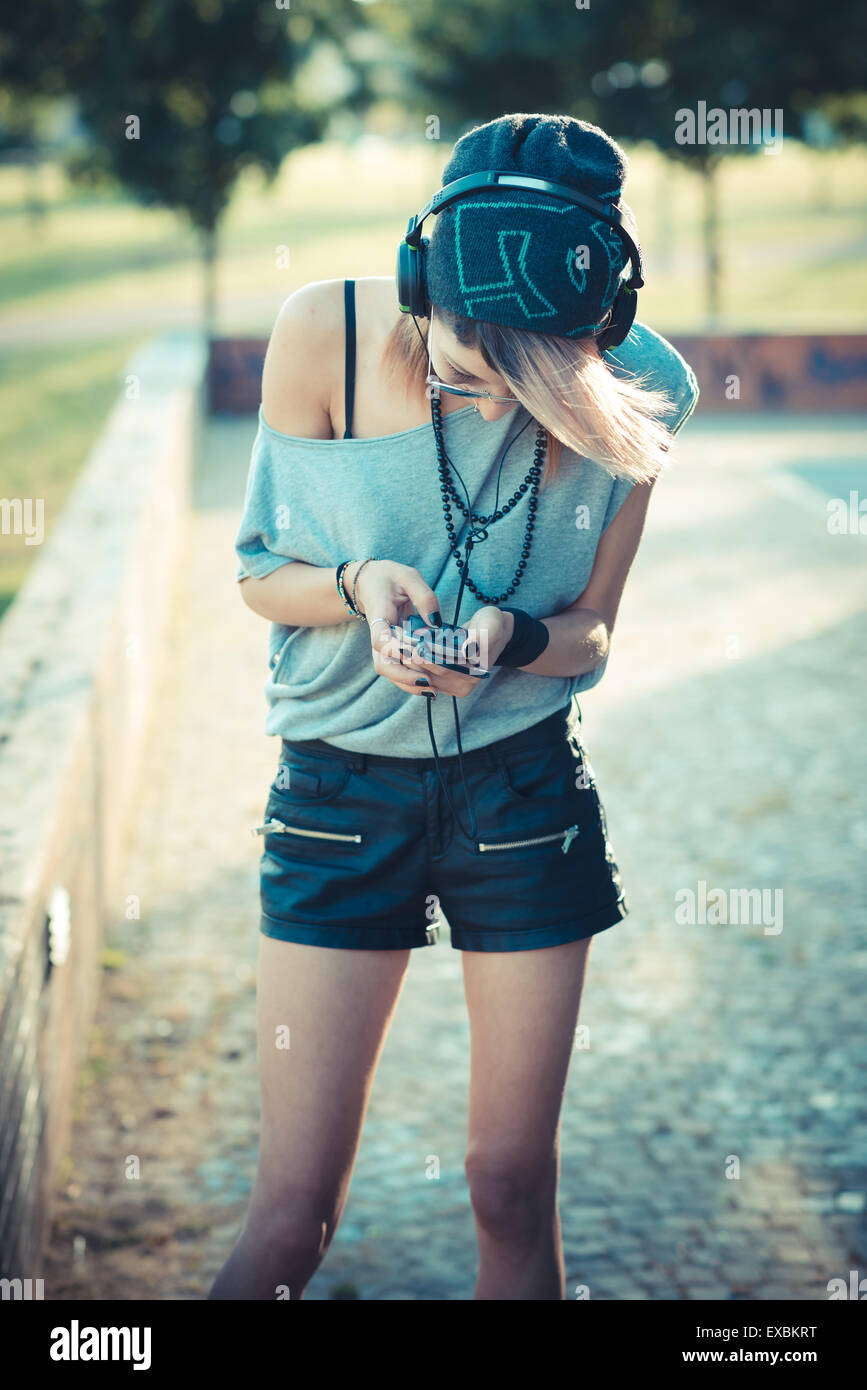 young beautiful model woman listening music in the city Stock Photo - Alamy
