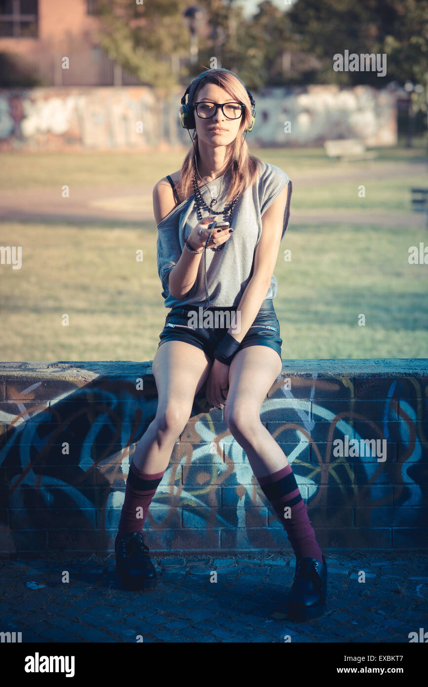 young beautiful model woman listening music in the city Stock Photo - Alamy