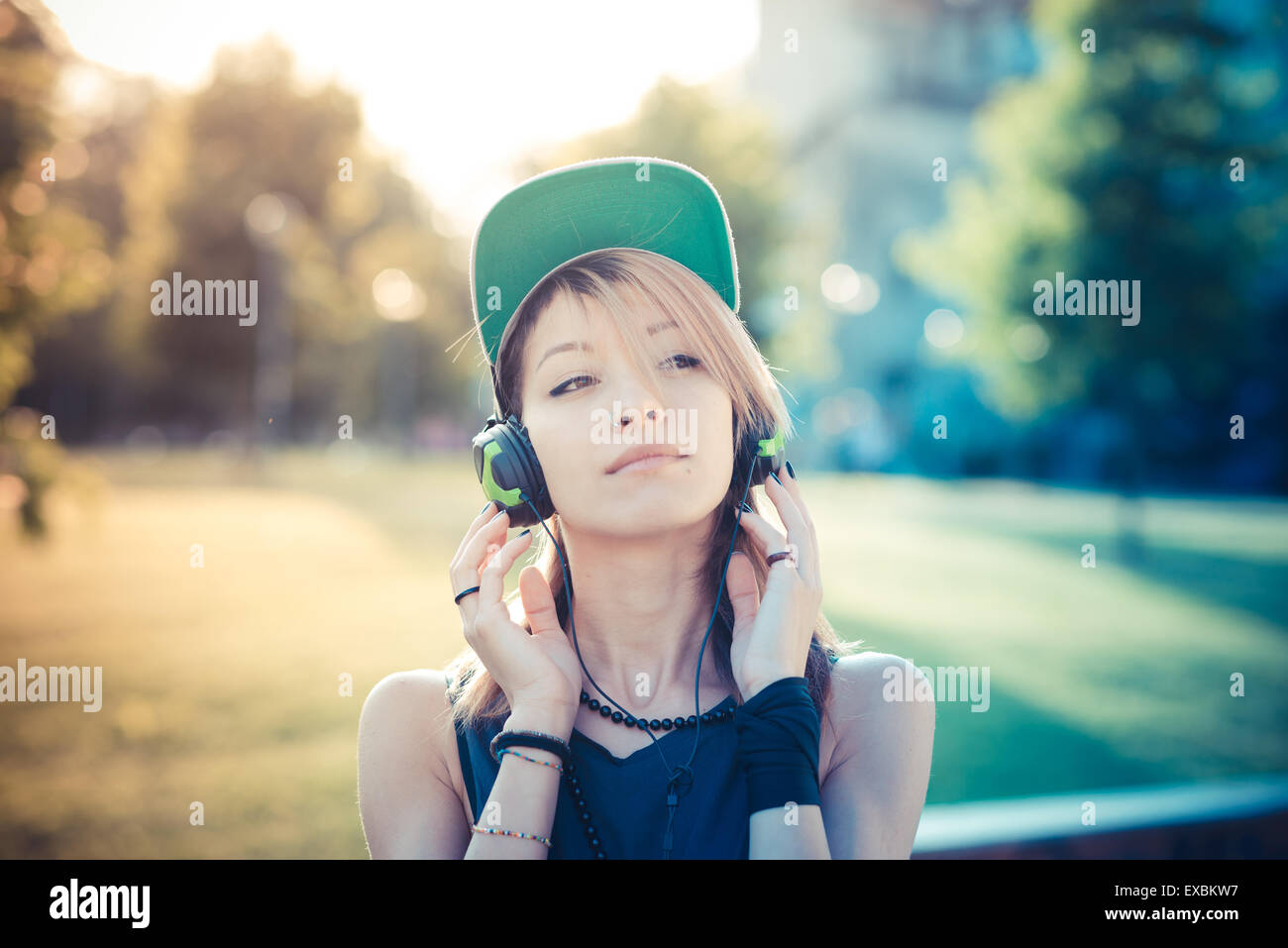 young beautiful model woman listening music in the city Stock Photo - Alamy