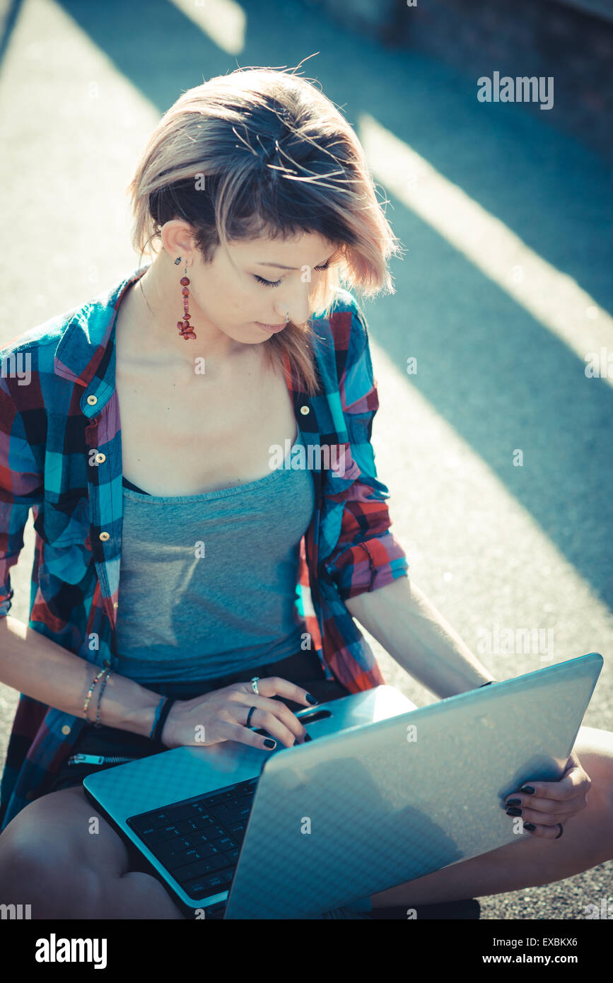 young beautiful model woman using notebook in the city Stock Photo - Alamy