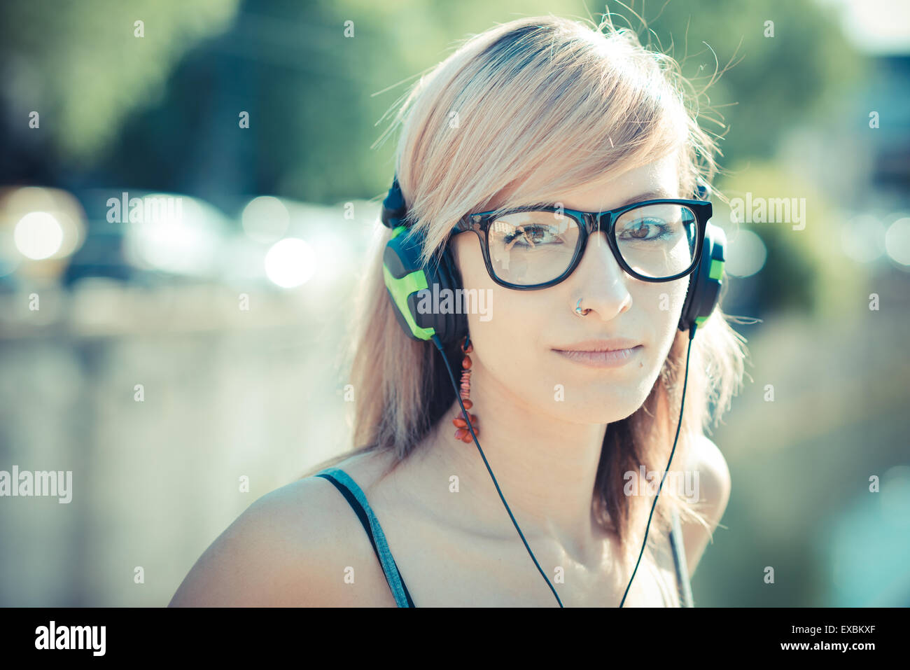 young beautiful model woman listening music in the city Stock Photo - Alamy