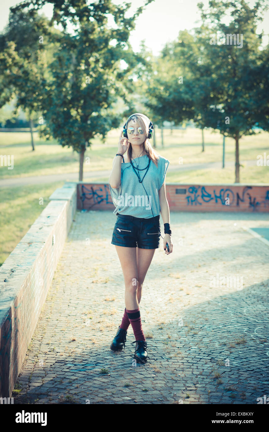 young beautiful model woman listening music in the city Stock Photo - Alamy