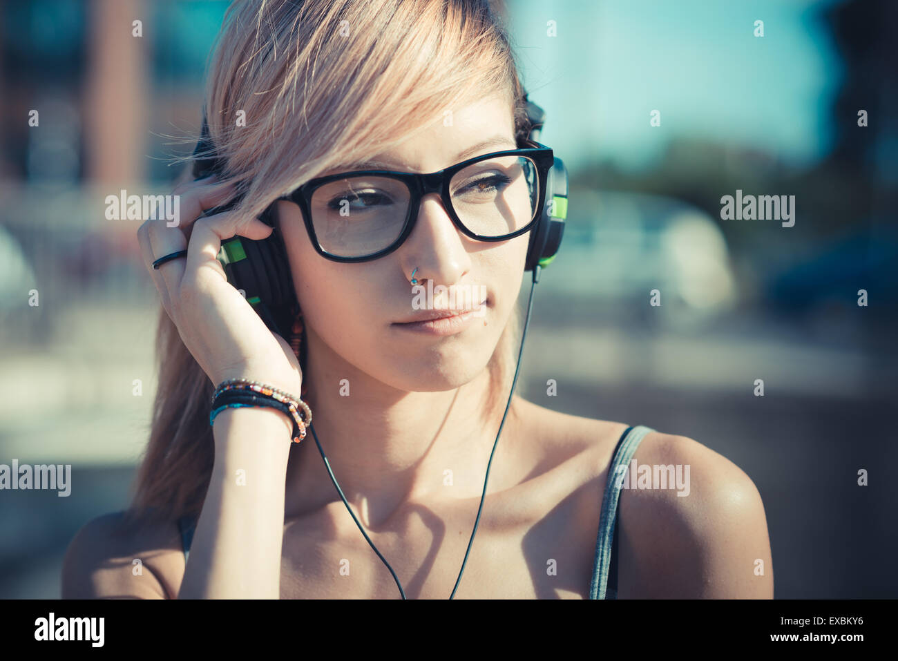 young beautiful model woman listening music in the city Stock Photo - Alamy