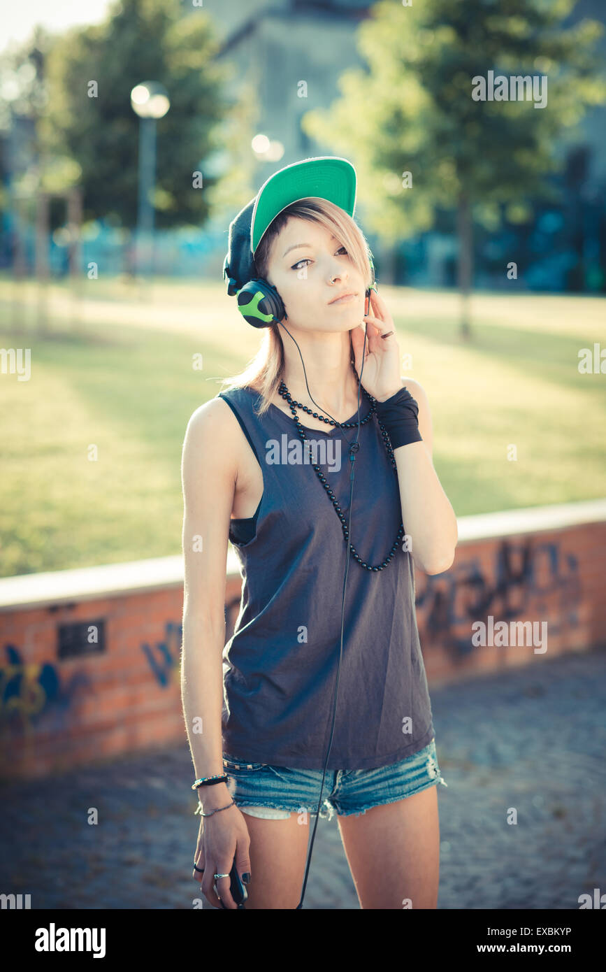 young beautiful model woman listening music in the city Stock Photo - Alamy
