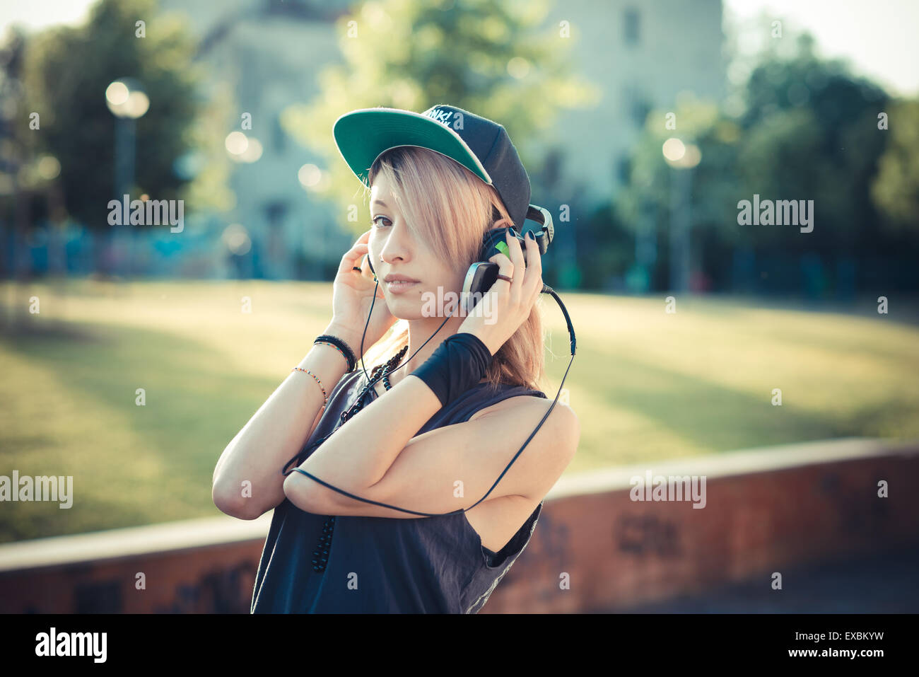 young beautiful model woman listening music in the city Stock Photo - Alamy