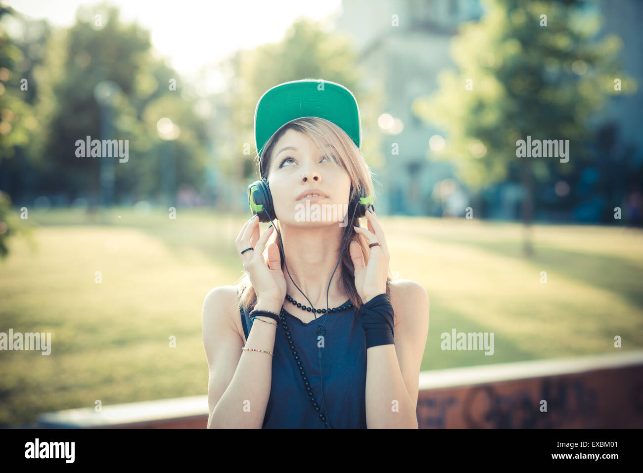 young beautiful model woman listening music in the city Stock Photo - Alamy