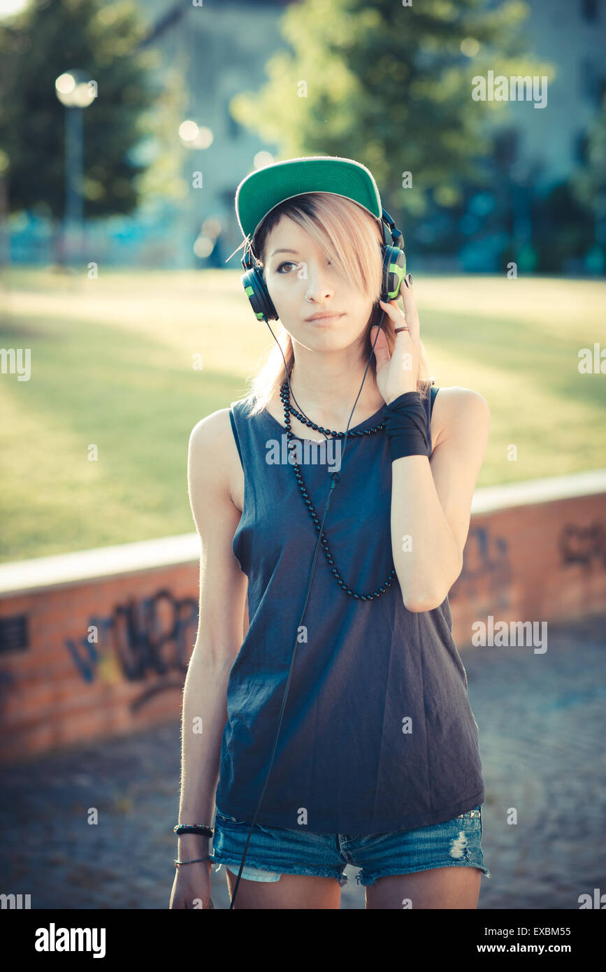 young beautiful model woman listening music in the city Stock Photo - Alamy