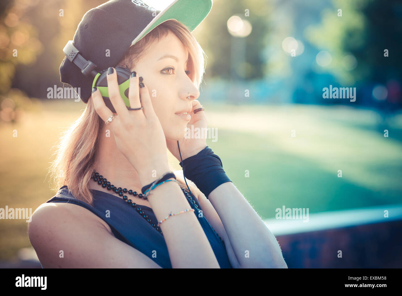 young beautiful model woman listening music in the city Stock Photo - Alamy