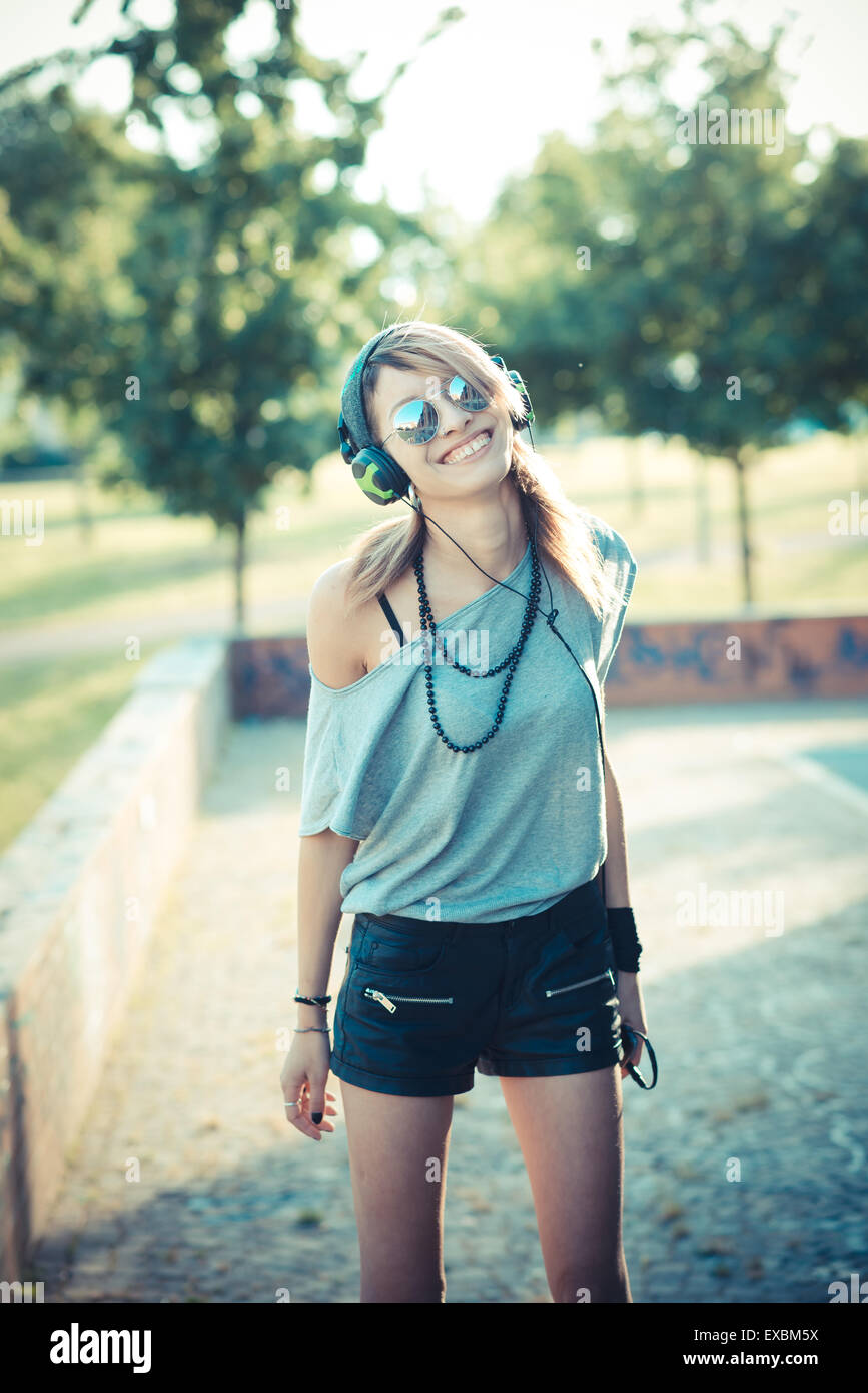 young beautiful model woman listening music in the city Stock Photo - Alamy