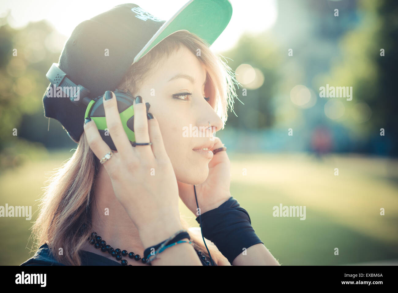 young beautiful model woman listening music in the city Stock Photo - Alamy