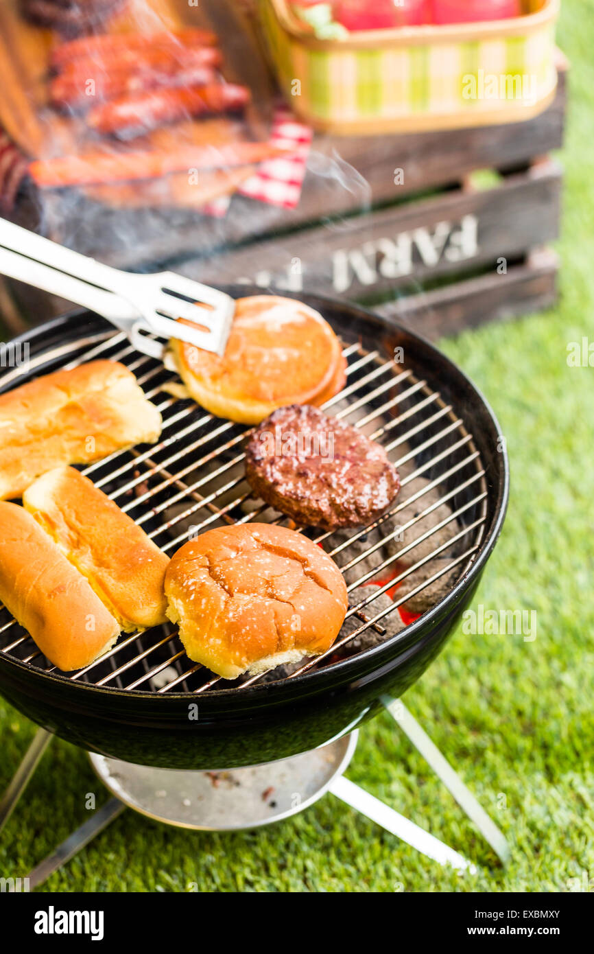 Summer picnic with small charcoal grill in the park Stock Photo - Alamy