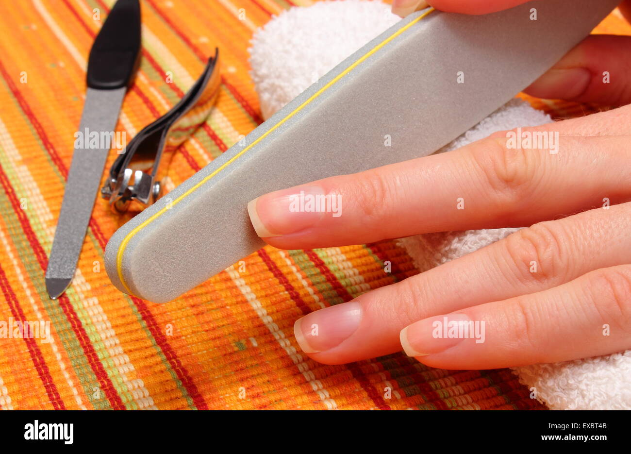 Woman polishing fingernails hi-res stock photography and images - Alamy