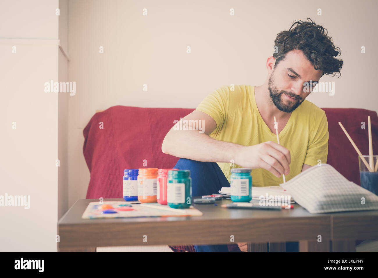 handsome hipster modern man painting at home Stock Photo - Alamy