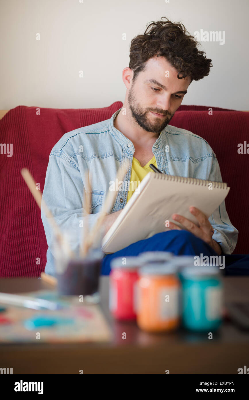 handsome hipster modern man painting at home Stock Photo - Alamy