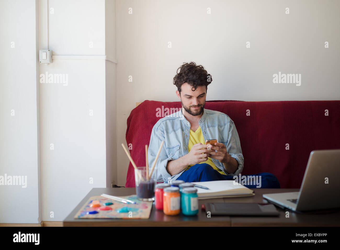 handsome hipster modern man painting at home Stock Photo - Alamy