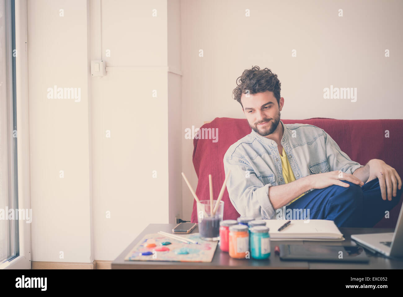 handsome hipster modern man painting at home Stock Photo - Alamy