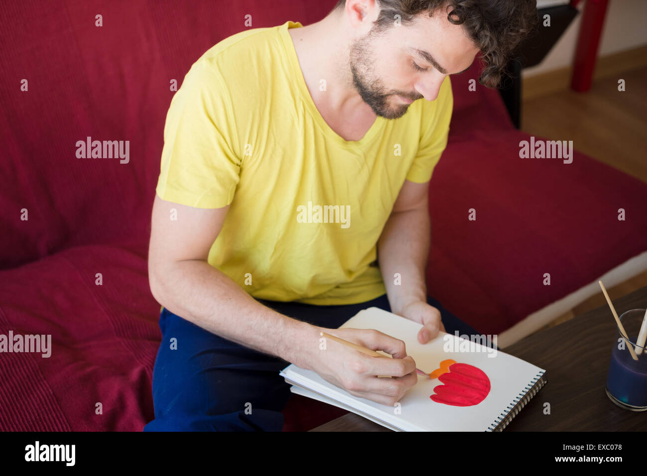 handsome hipster modern man painting at home Stock Photo - Alamy