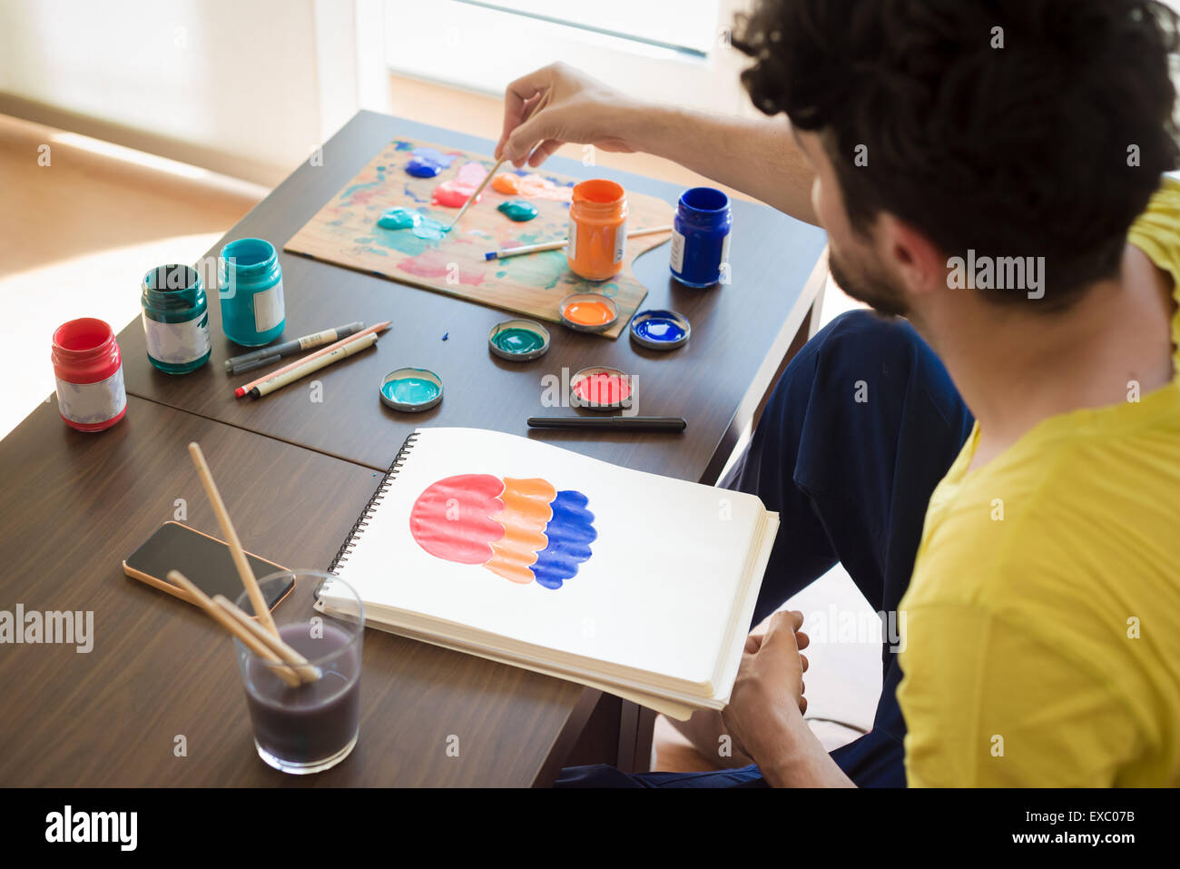 handsome hipster modern man painting at home Stock Photo - Alamy