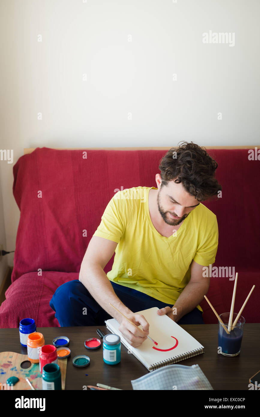 handsome hipster modern man painting at home Stock Photo - Alamy