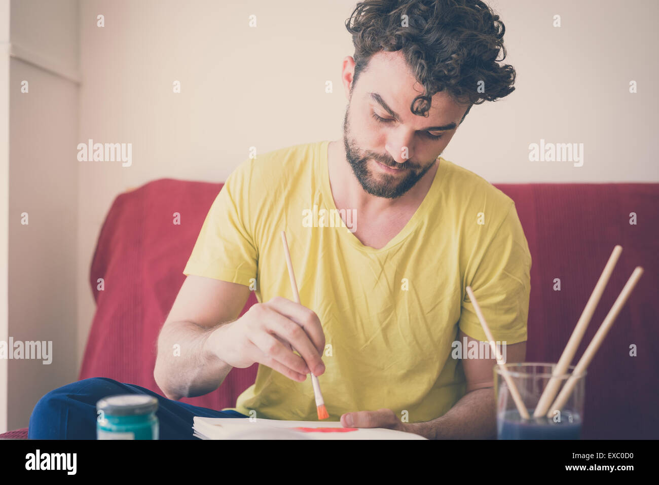 handsome hipster modern man painting at home Stock Photo - Alamy