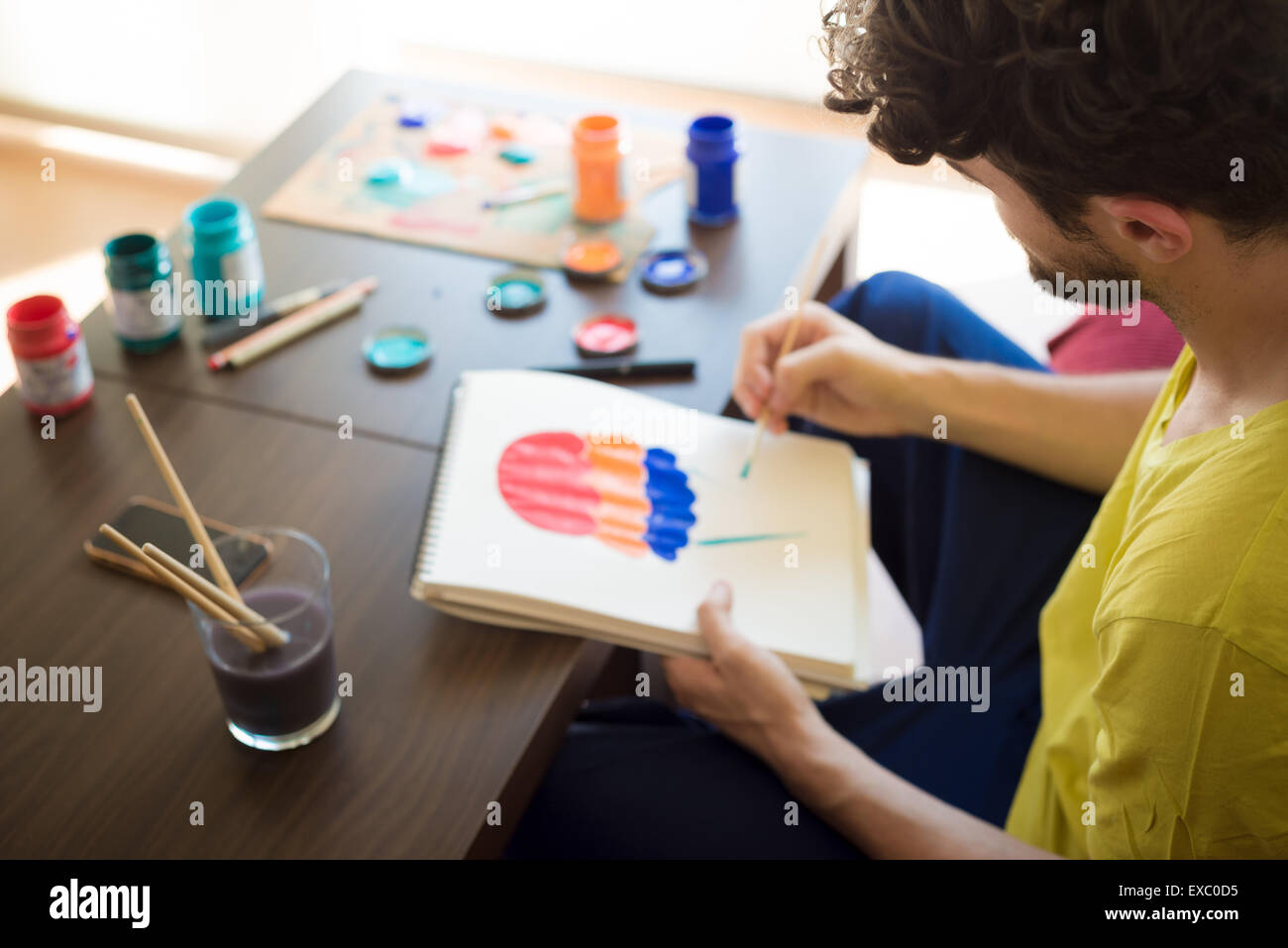 handsome hipster modern man painting at home Stock Photo - Alamy