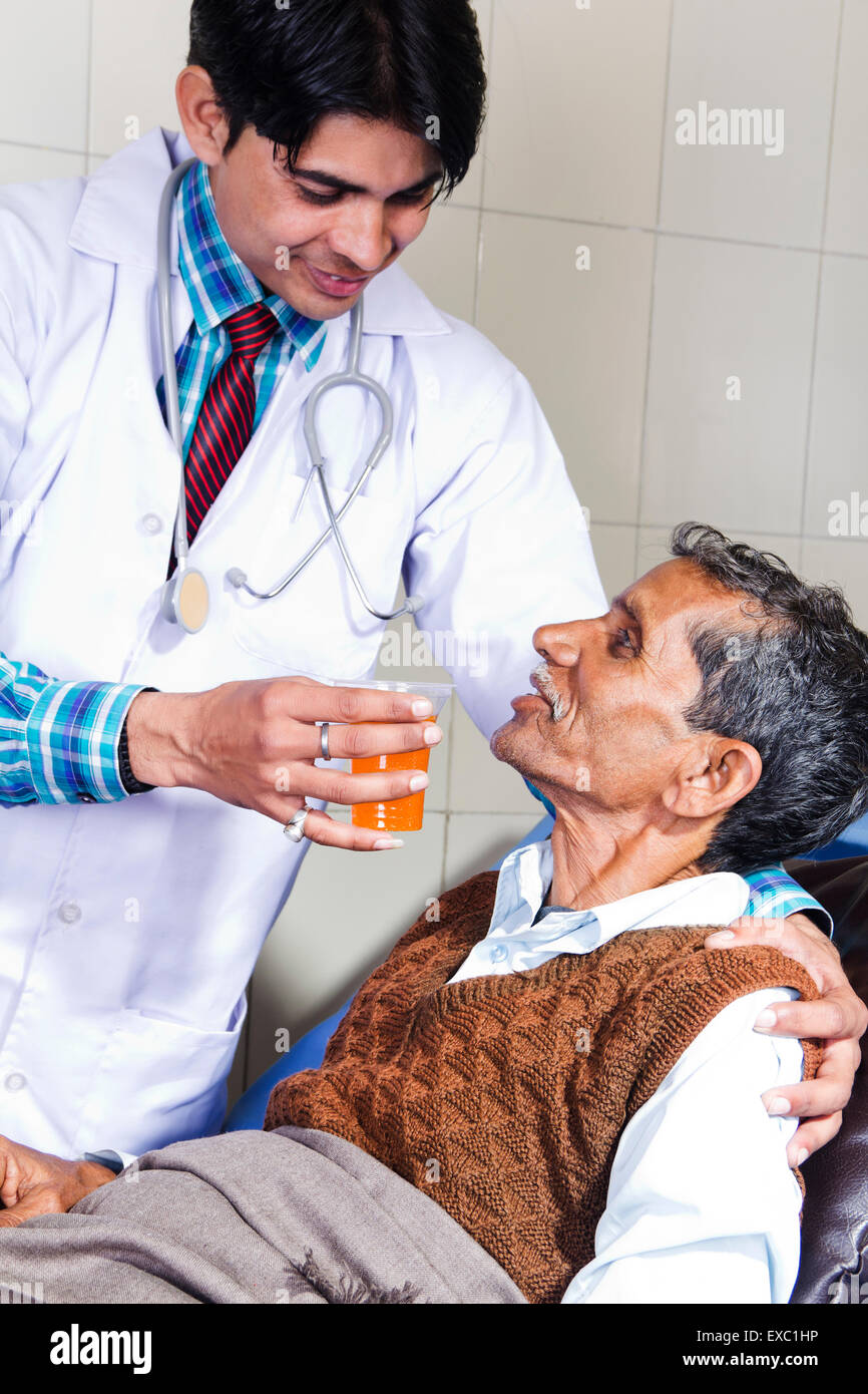 indian doctor hospital Patient feeding juice Stock Photo - Alamy