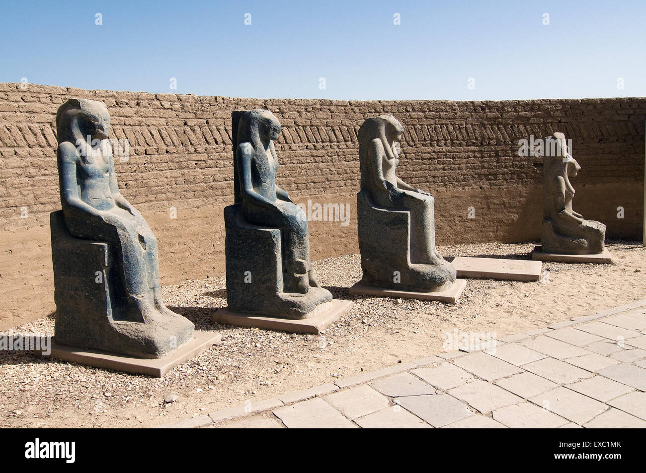 Karnak, Luxor, Egypt. Temple of Karnak sacred to god Amon: four statues ...
