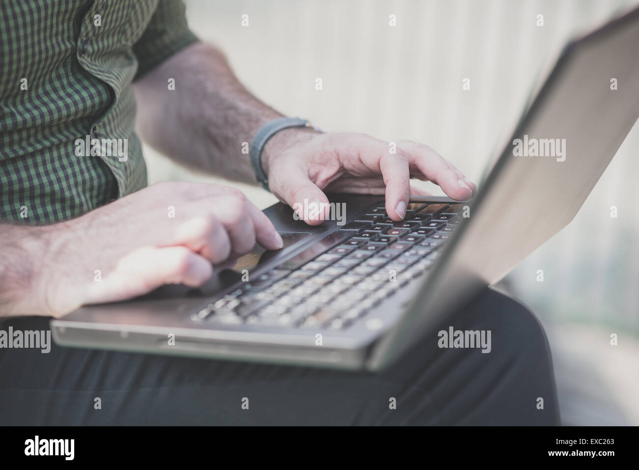 close up of man hands using laptop outdoor Stock Photo - Alamy