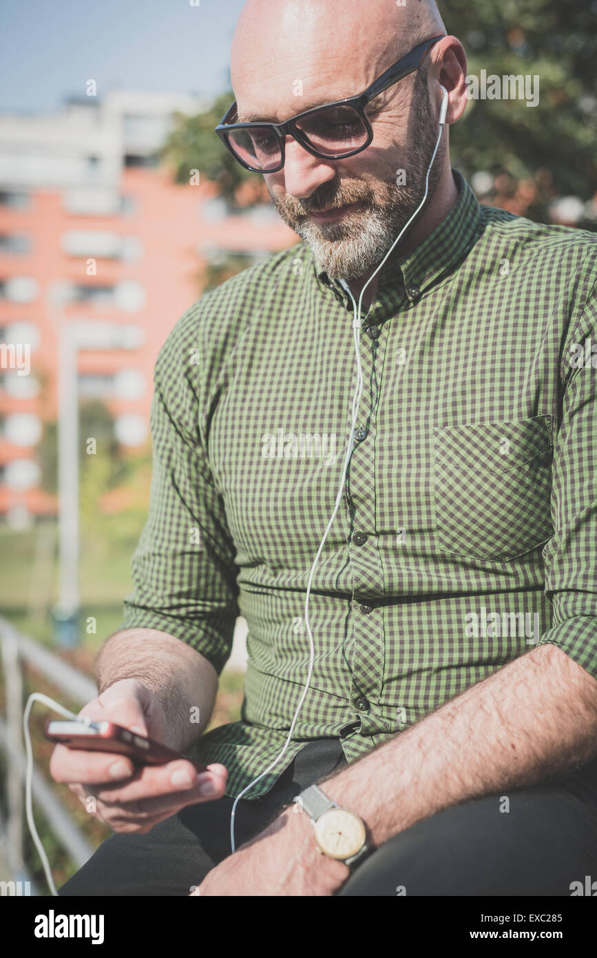 handsome middle aged man listening to music in the city Stock Photo - Alamy