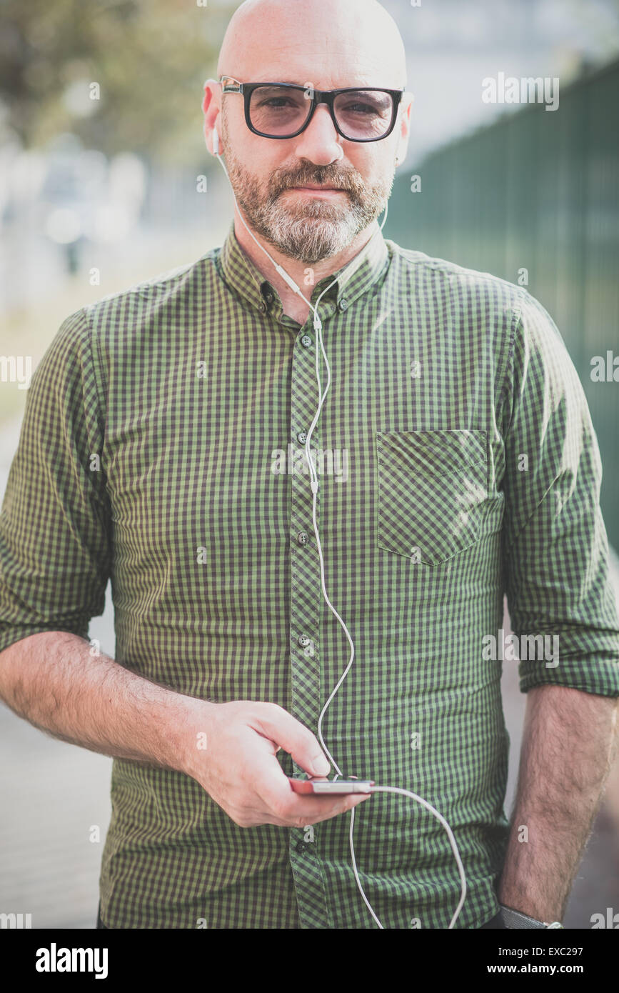 handsome middle aged man listening to music in the city Stock Photo - Alamy