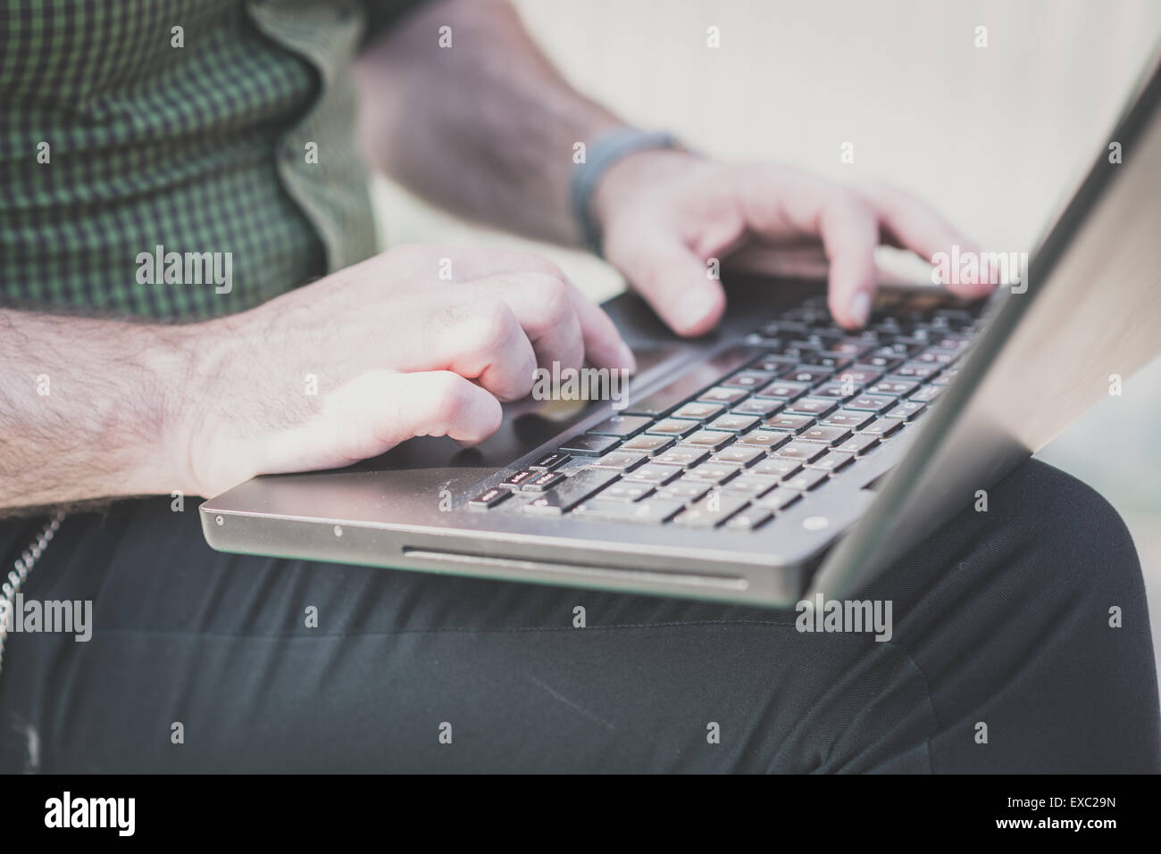 close up of man hands using laptop outdoor Stock Photo - Alamy