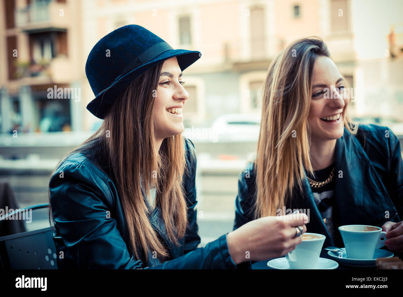 two beautiful friends authentic at the bar Stock Photo - Alamy