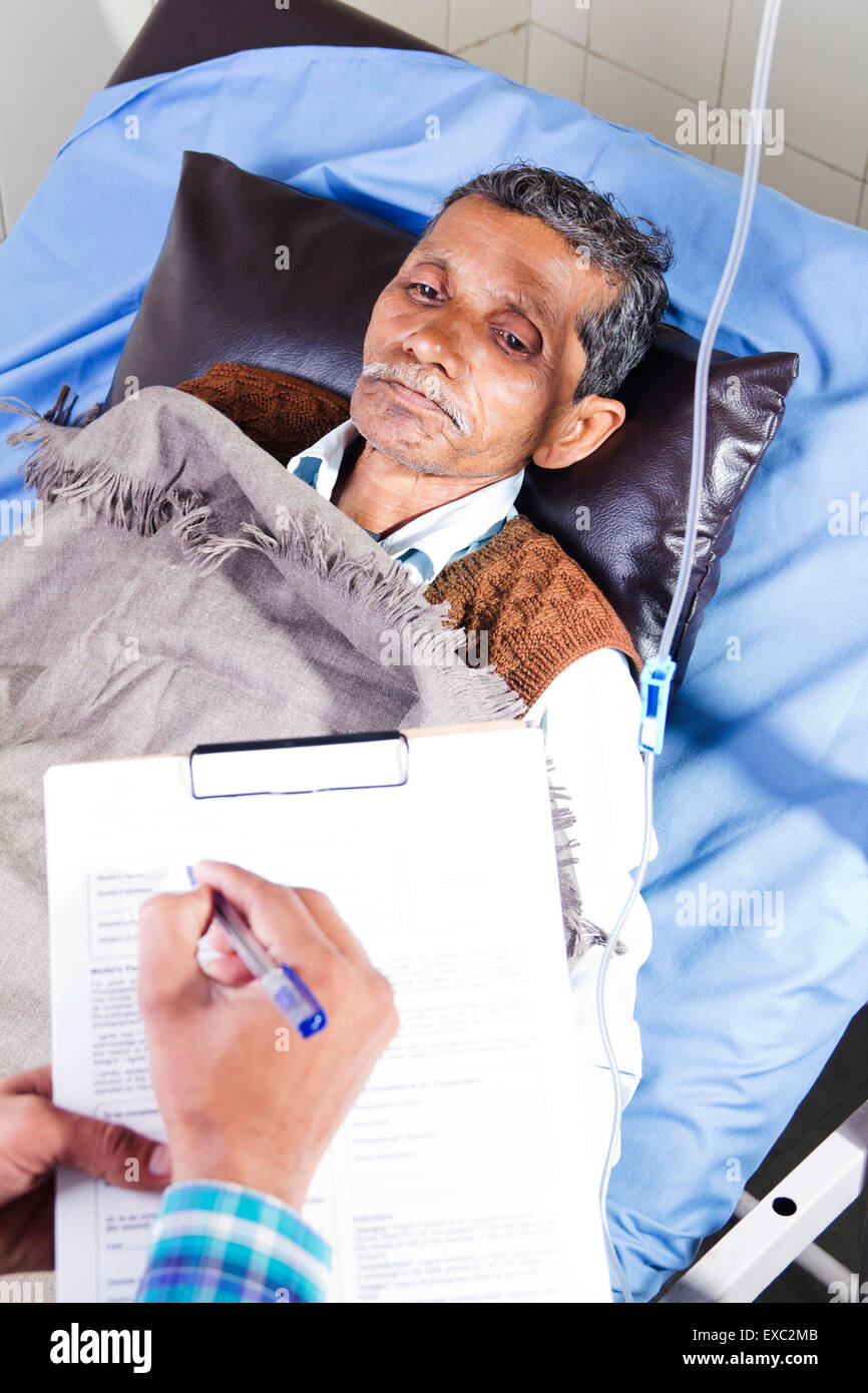 indian doctor hospital Patient writing report Stock Photo - Alamy