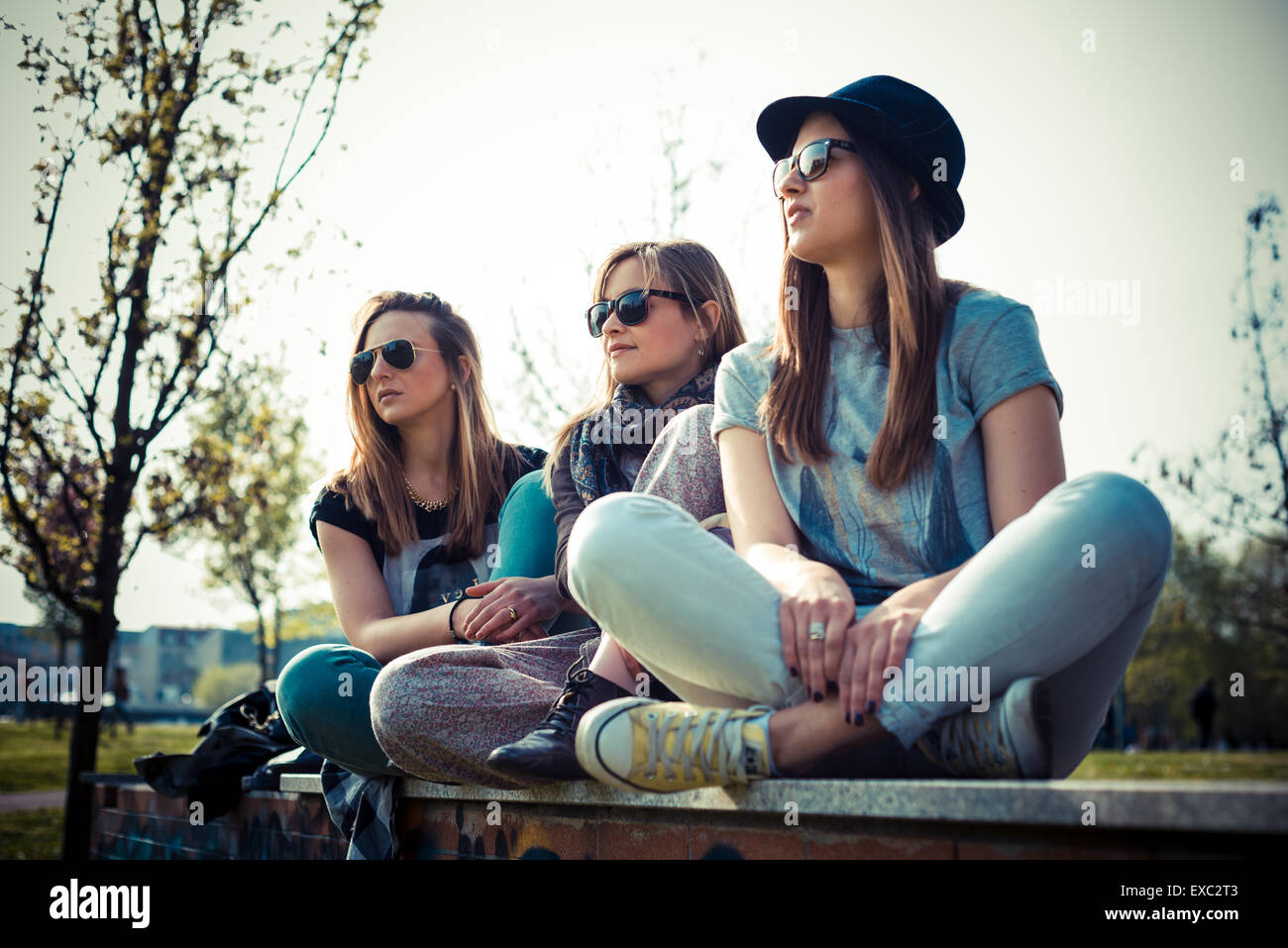 three beautiful friends authentic in urban contest Stock Photo - Alamy