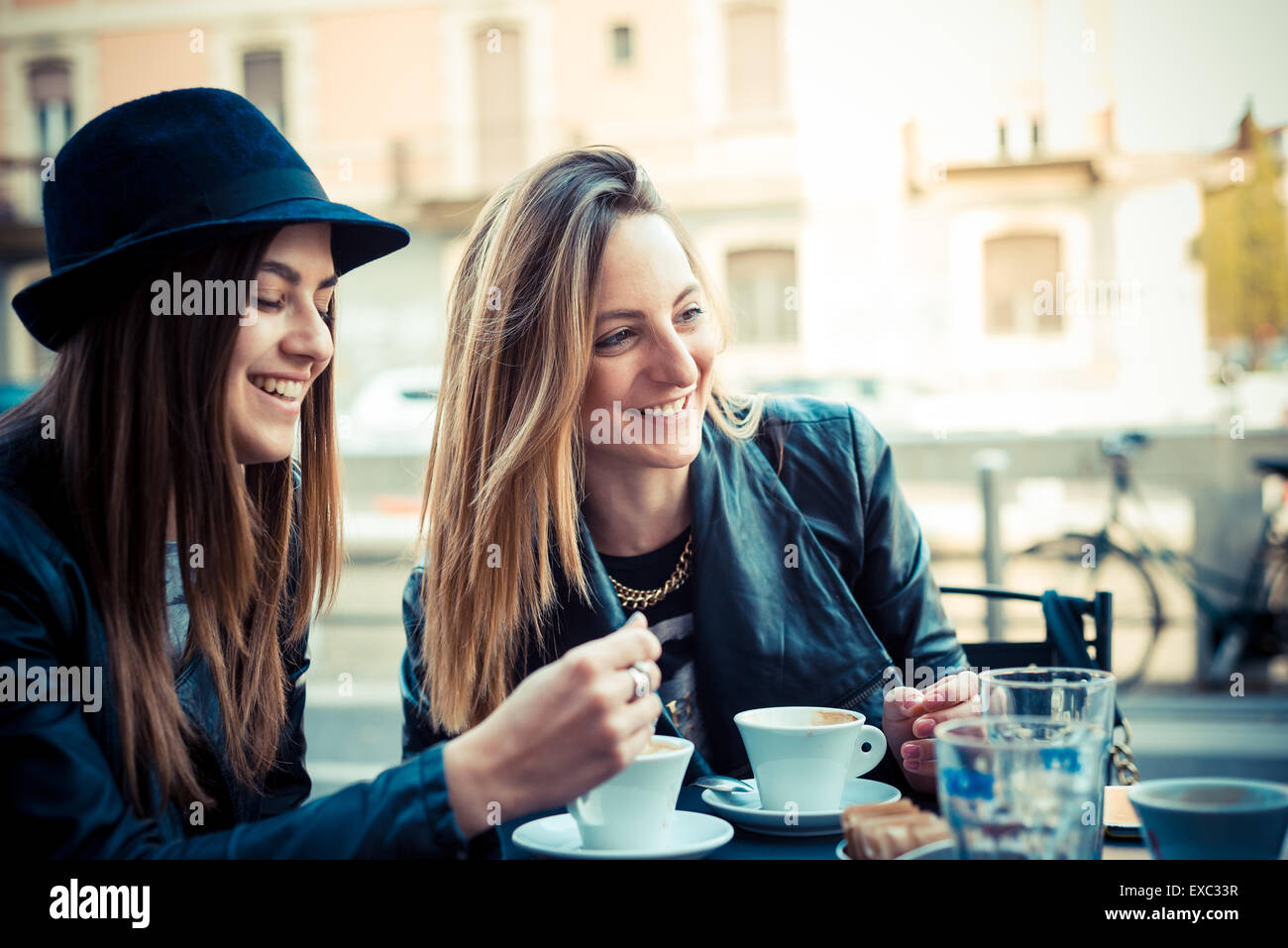 two beautiful friends authentic at the bar Stock Photo - Alamy