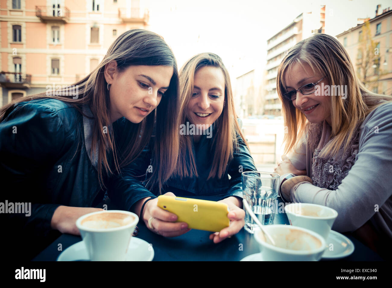 three beautiful friends authentic in urban contest Stock Photo - Alamy