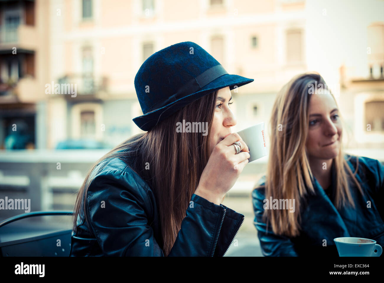 two beautiful friends authentic at the bar Stock Photo - Alamy