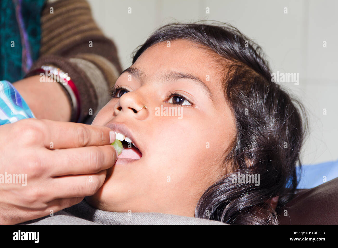 indian doctor hospital Patient Feeding fruit Stock Photo - Alamy