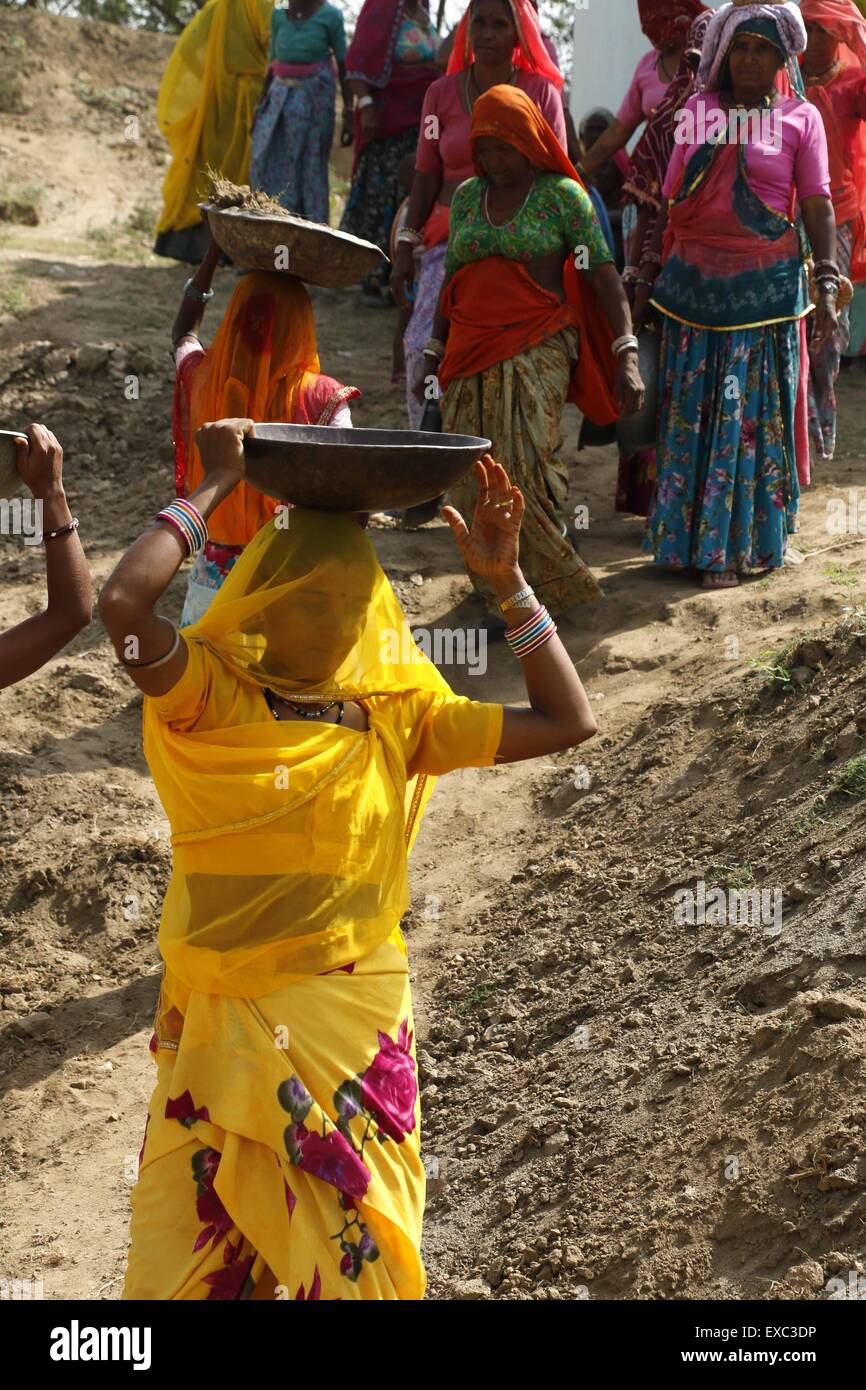 Villagers work on a NREGA (National Rural Employment Guarantee Act ...