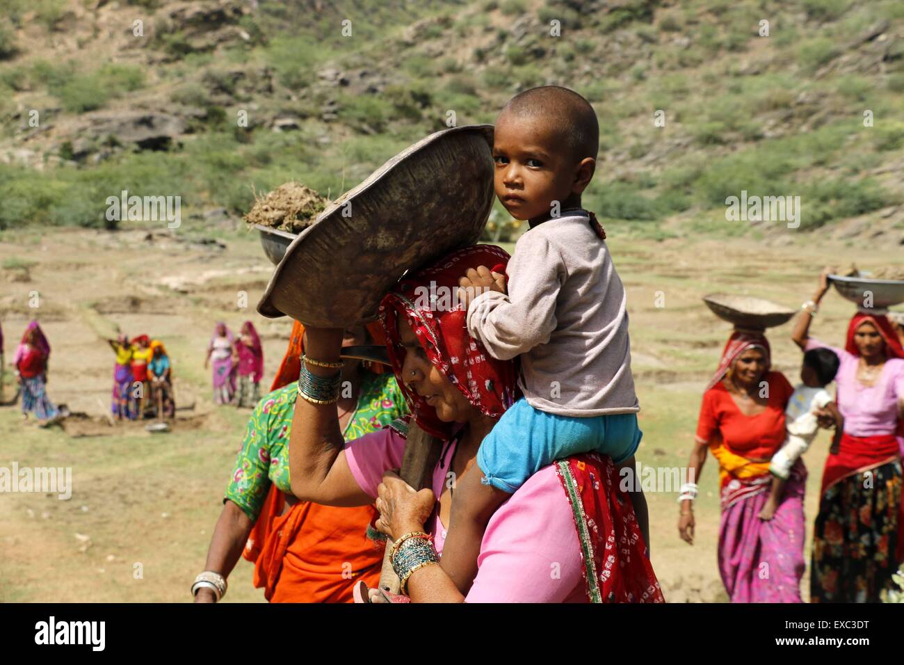 Villagers work on a NREGA (National Rural Employment Guarantee Act ...