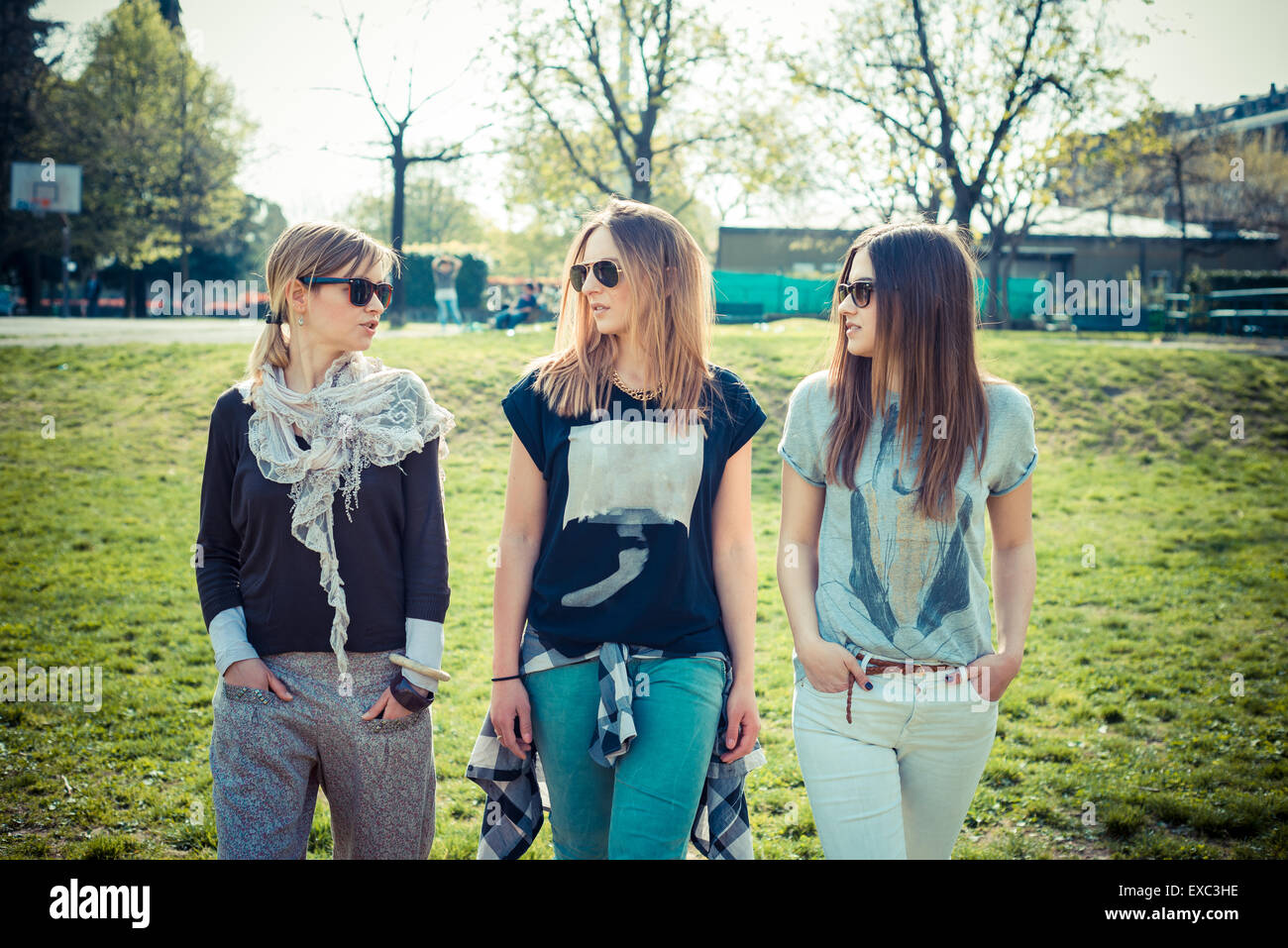 three beautiful friends authentic in urban contest Stock Photo - Alamy
