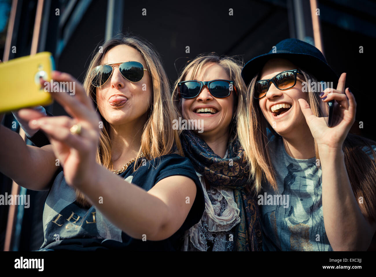 three beautiful friends authentic in urban contest Stock Photo - Alamy
