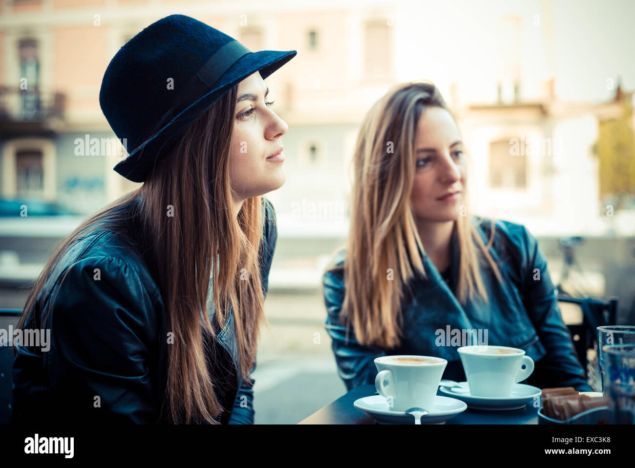 two beautiful friends authentic at the bar Stock Photo - Alamy