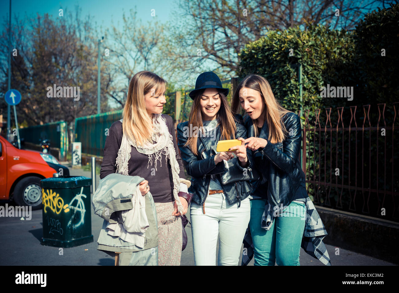 three beautiful friends authentic in urban contest Stock Photo - Alamy