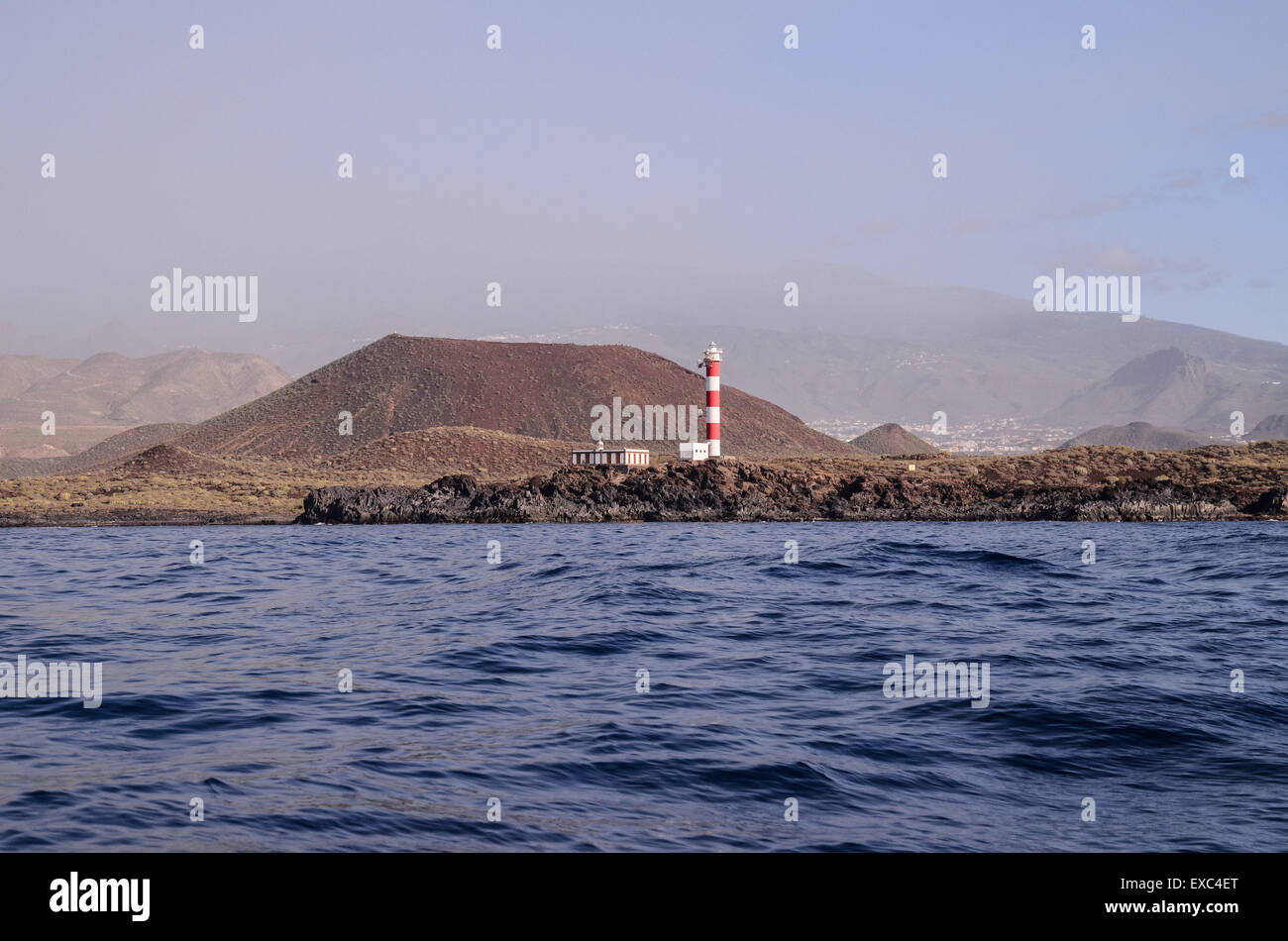 High Lighthouse near the Coast Stock Photo - Alamy