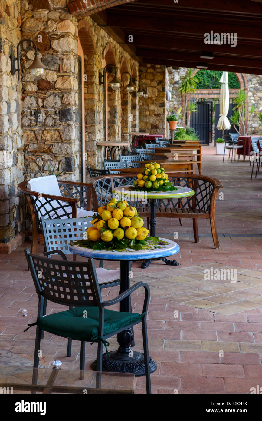 Hotel patio with tables decorated with bunches of lemons Stock Photo ...