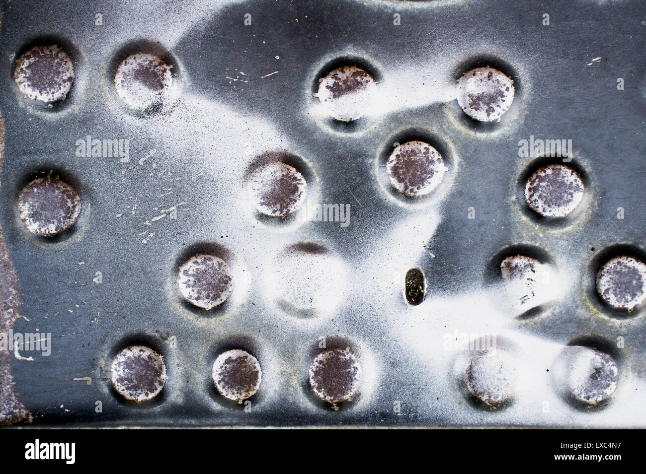A studded metal surface as a background image Stock Photo - Alamy