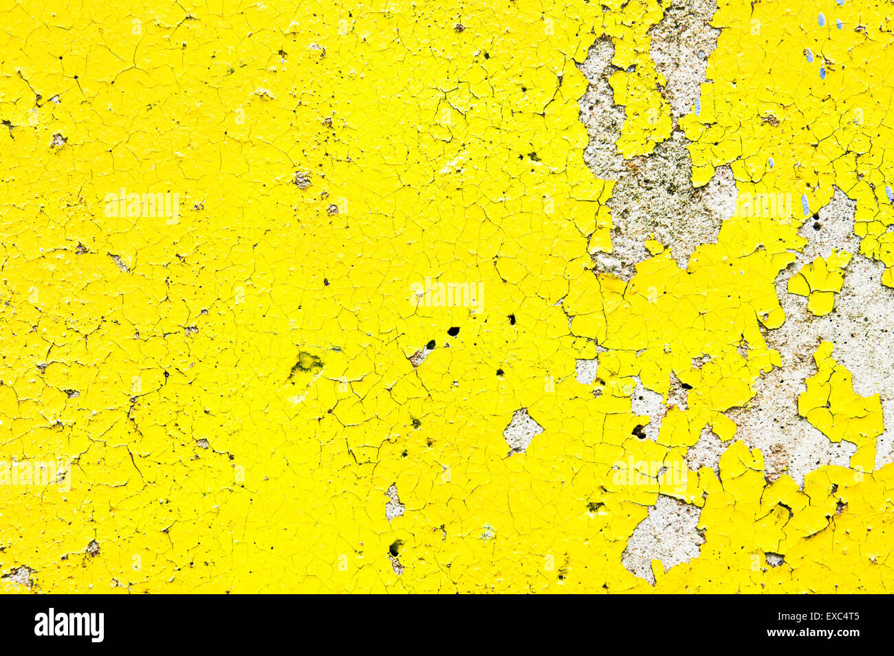 Cracked yellow paint on a stone surface as a background image Stock ...