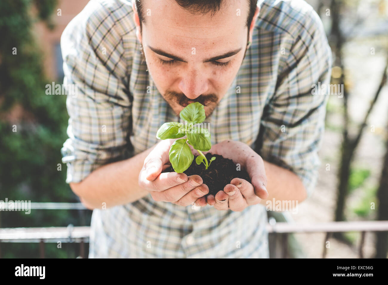 handsome stylish man gardening at home Stock Photo - Alamy
