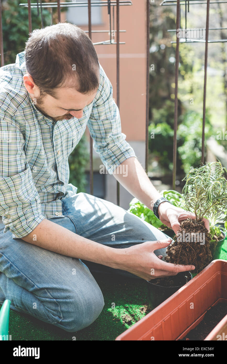 handsome stylish man gardening at home Stock Photo - Alamy